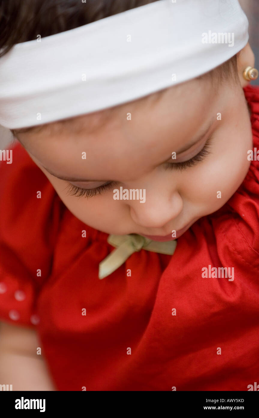 new born baby girl looking down Stock Photo - Alamy
