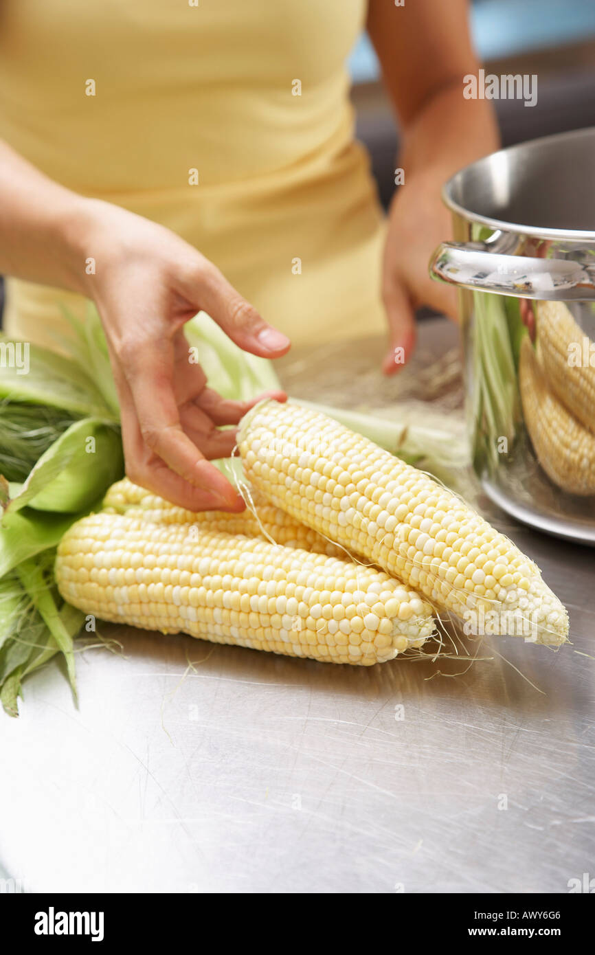 Husking corn hi-res stock photography and images - Alamy