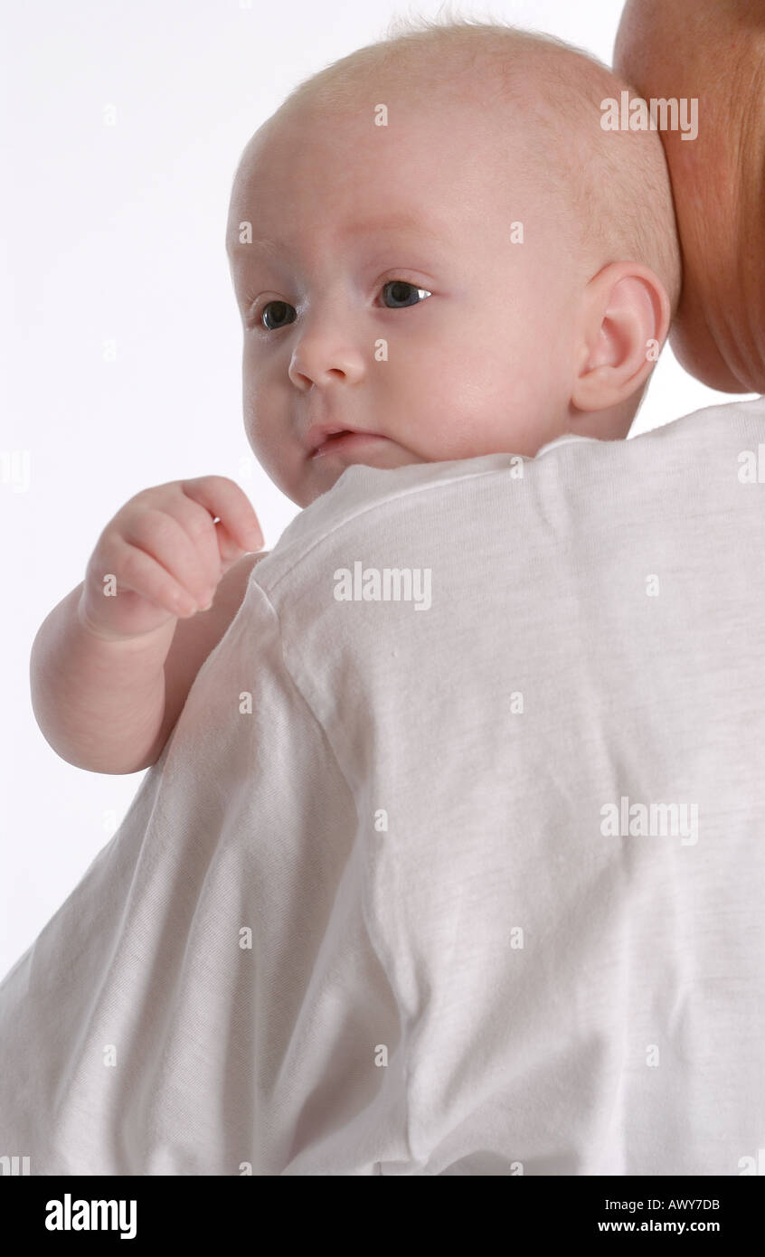 baby looking over mothers shoulder Stock Photo - Alamy