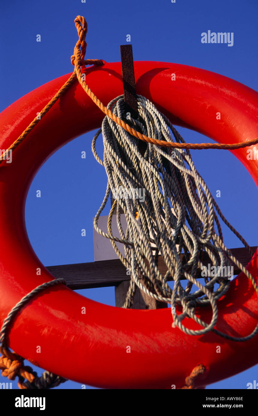 Red life belt on Shingle Street beach Stock Photo - Alamy