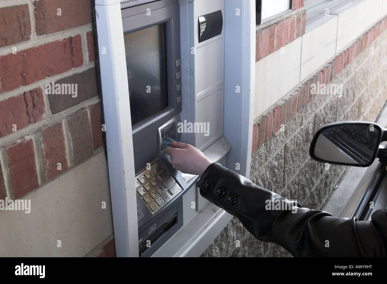 A woman using a drive up ATM Stock Photo - Alamy