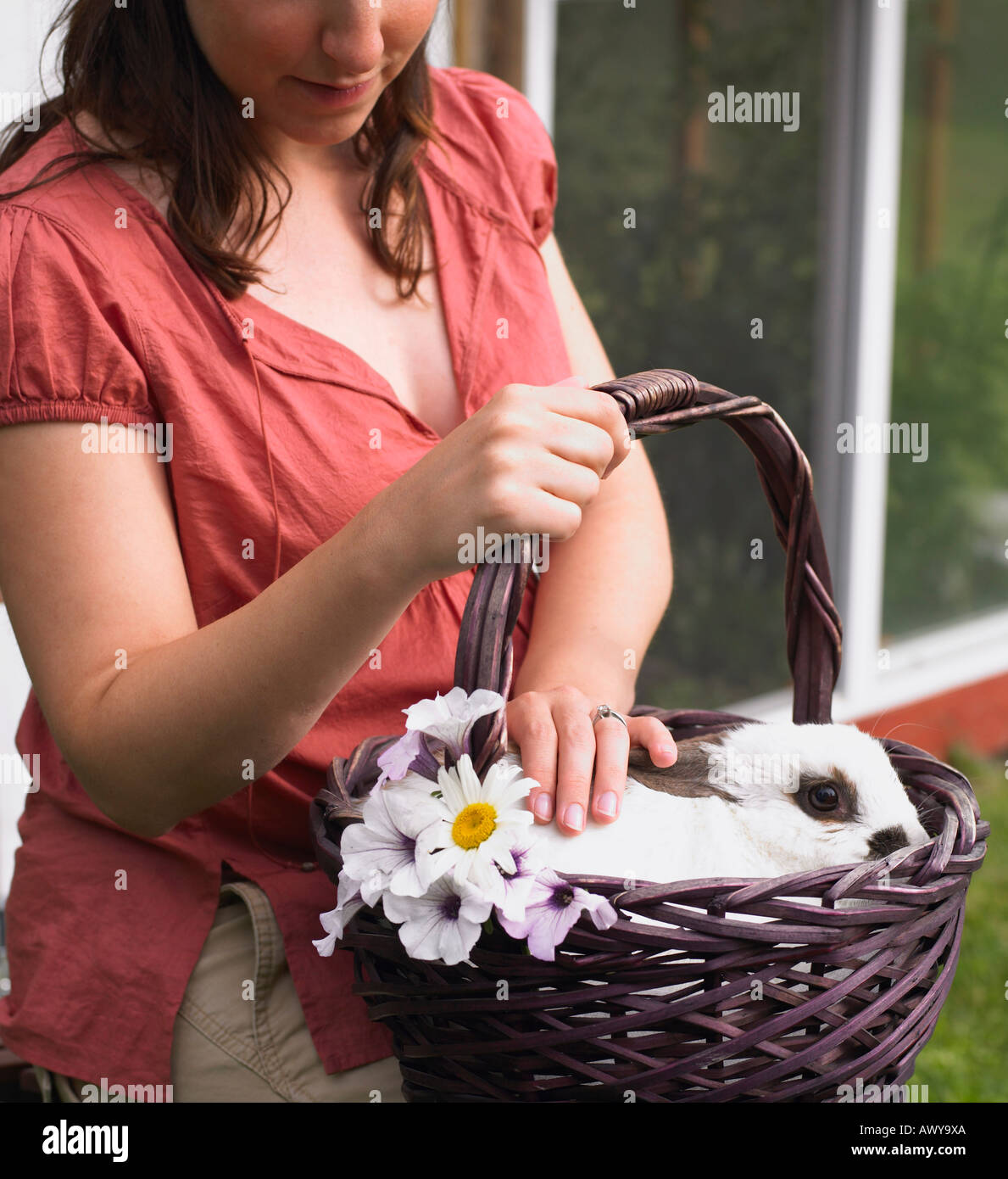 Sitting woman holding rabbit hi-res stock photography and images - Alamy