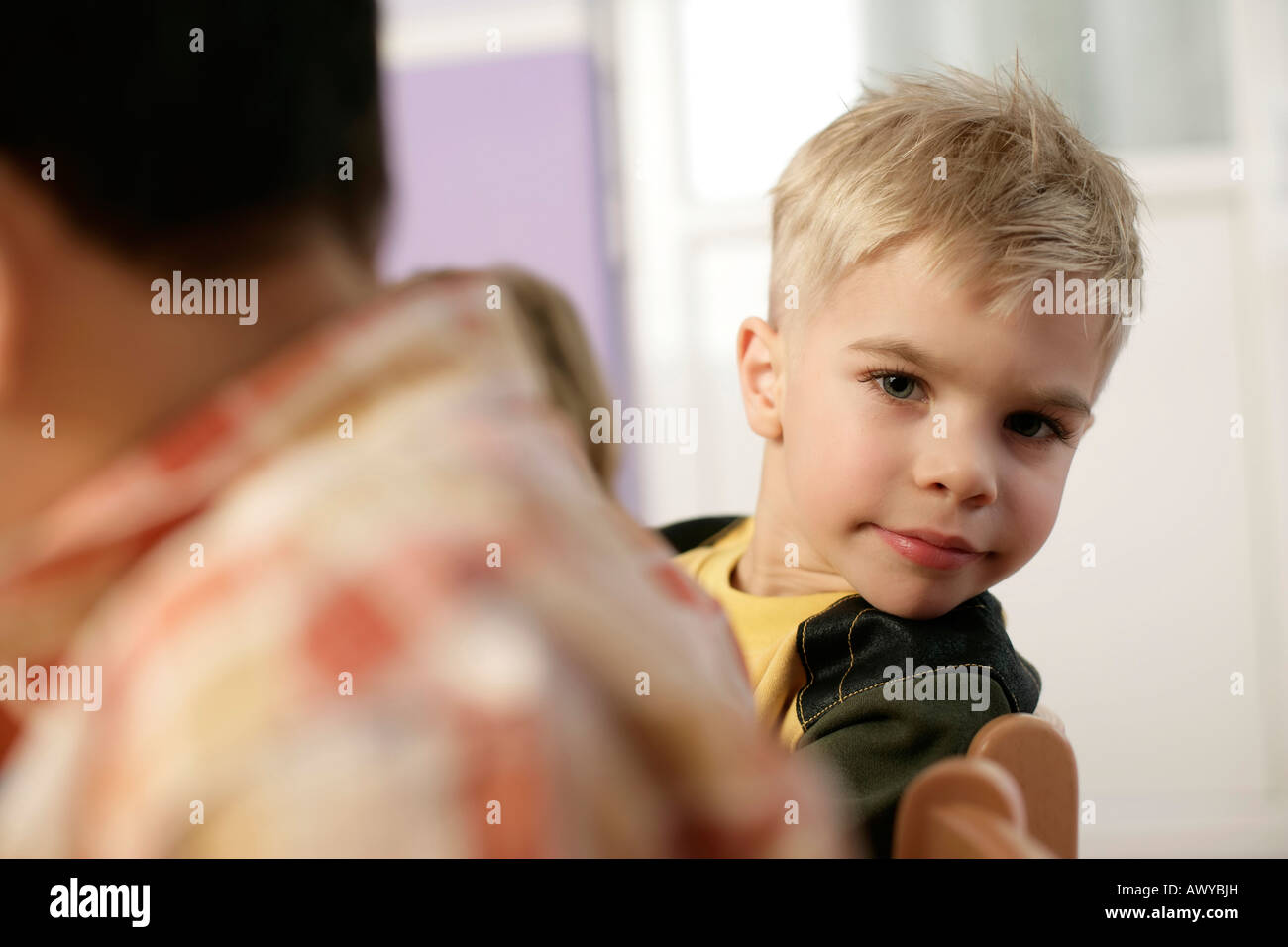 Little boy looking at camera at the back of another boy, portrait Stock ...
