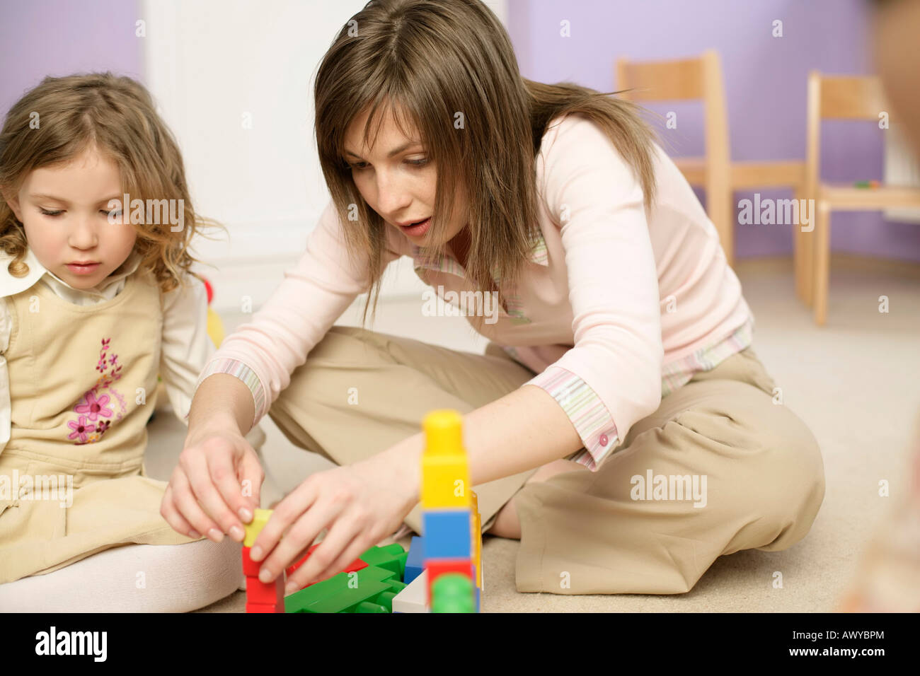 Mother and daughter playing with blocks Stock Photo - Alamy