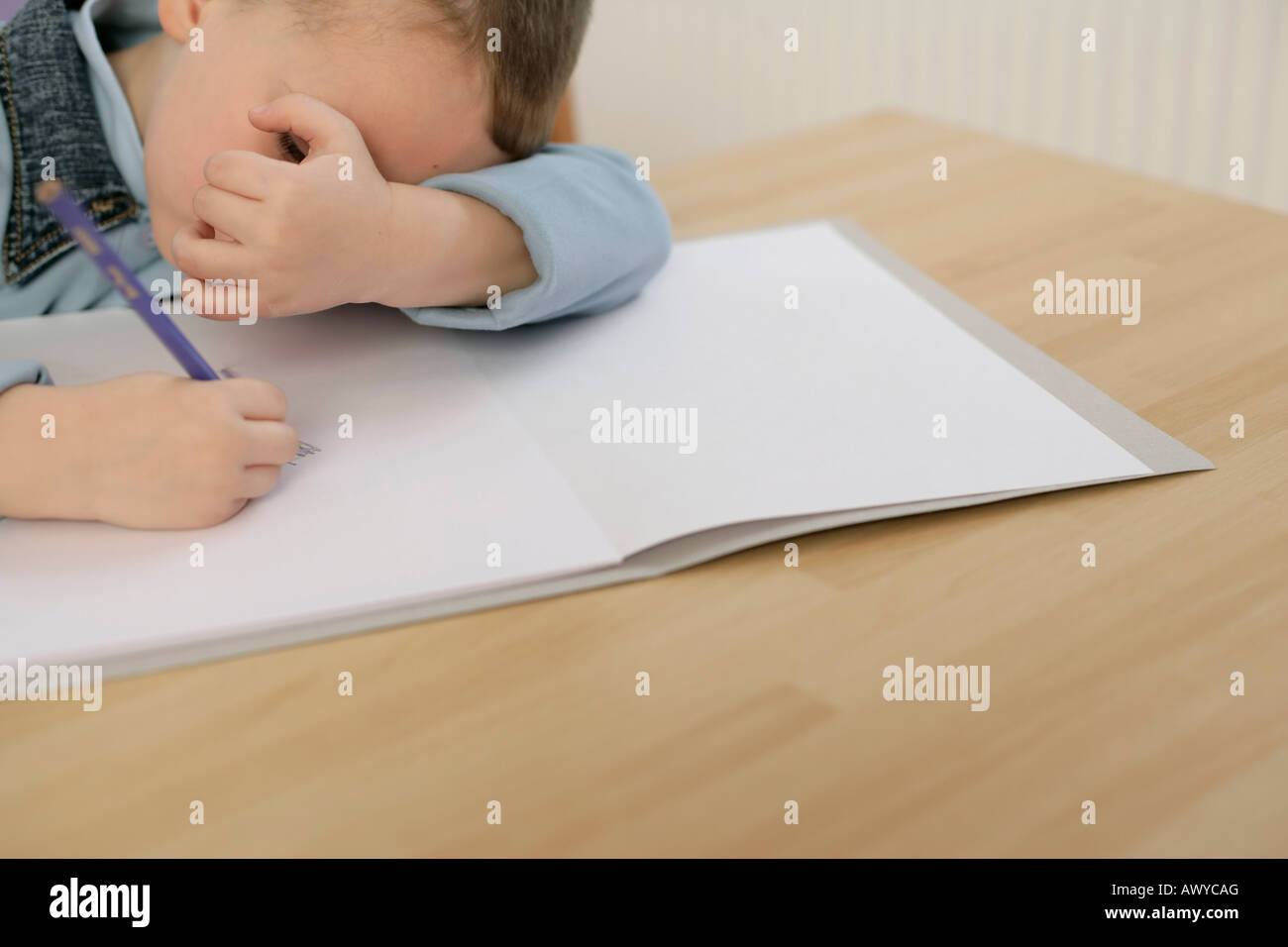 Boy drawing, covering his face with hand Stock Photo - Alamy