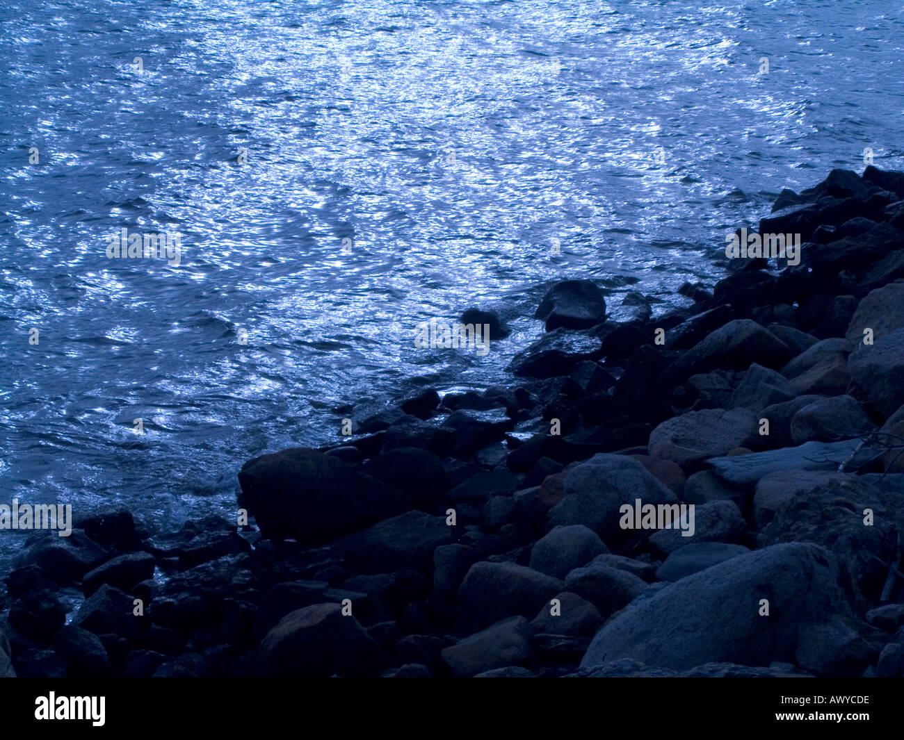 Water from Narragansett bay laps up against the shore Stock Photo - Alamy