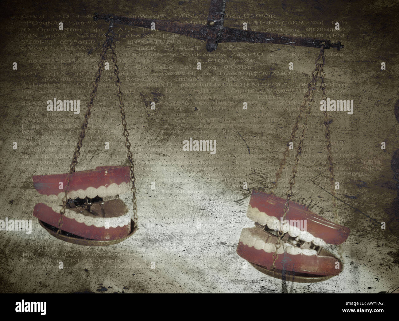 Chattering teeth facing each other in the pans of a scale Stock Photo ...