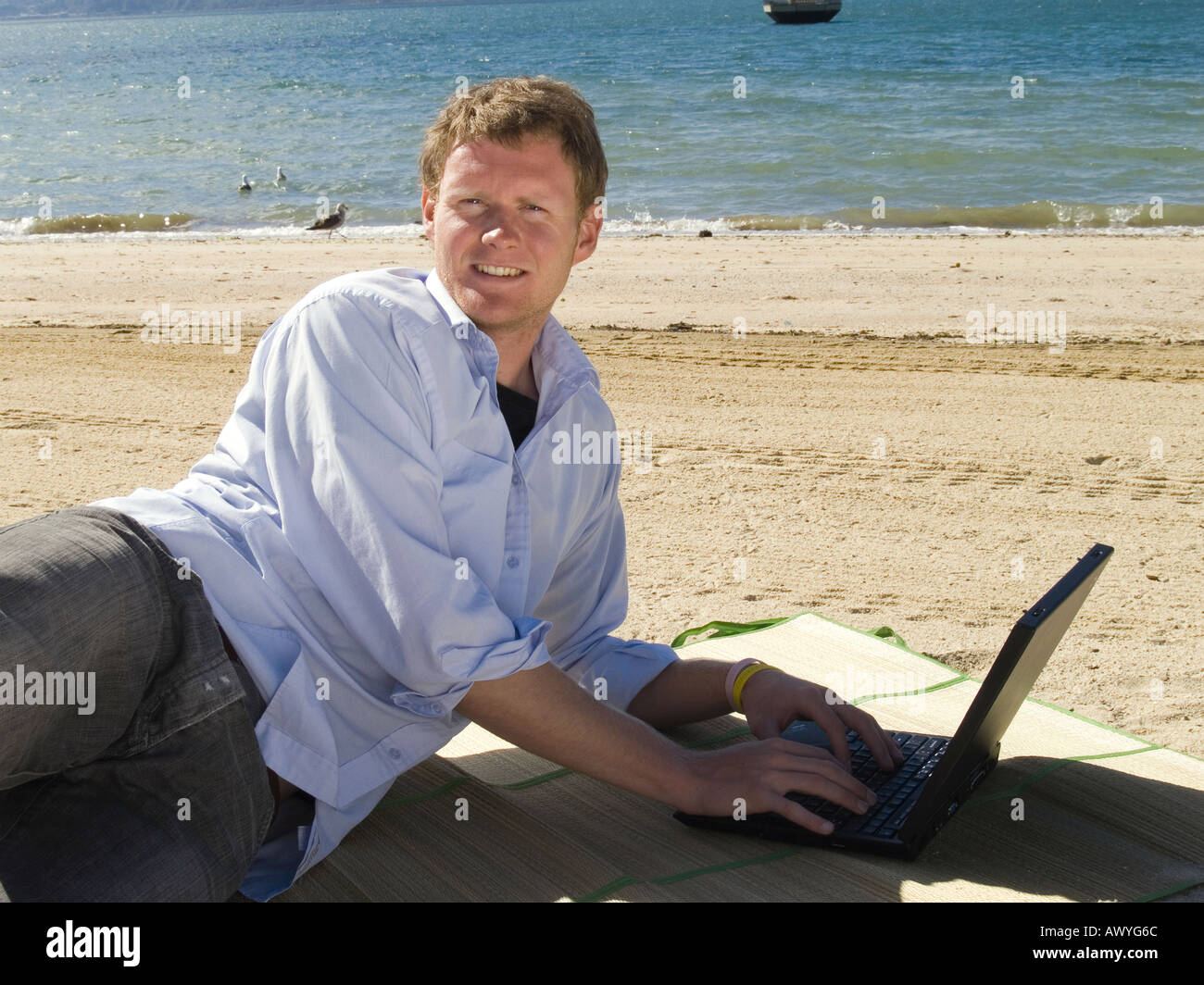 Businessman resting on beach hi-res stock photography and images - Alamy