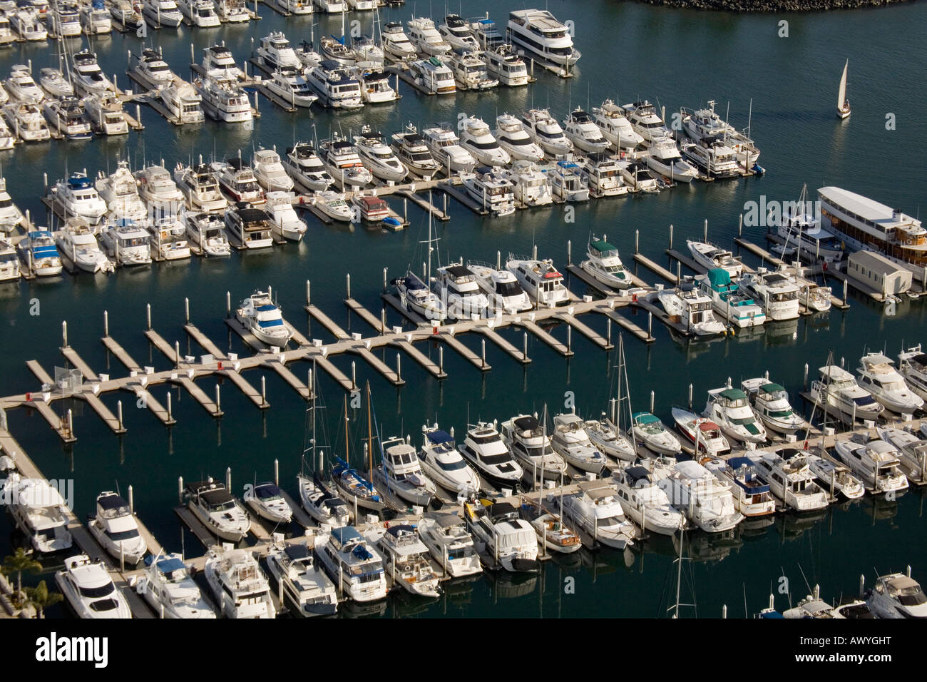 Looking down on a busy marina where numerous private pleasure boats are ...
