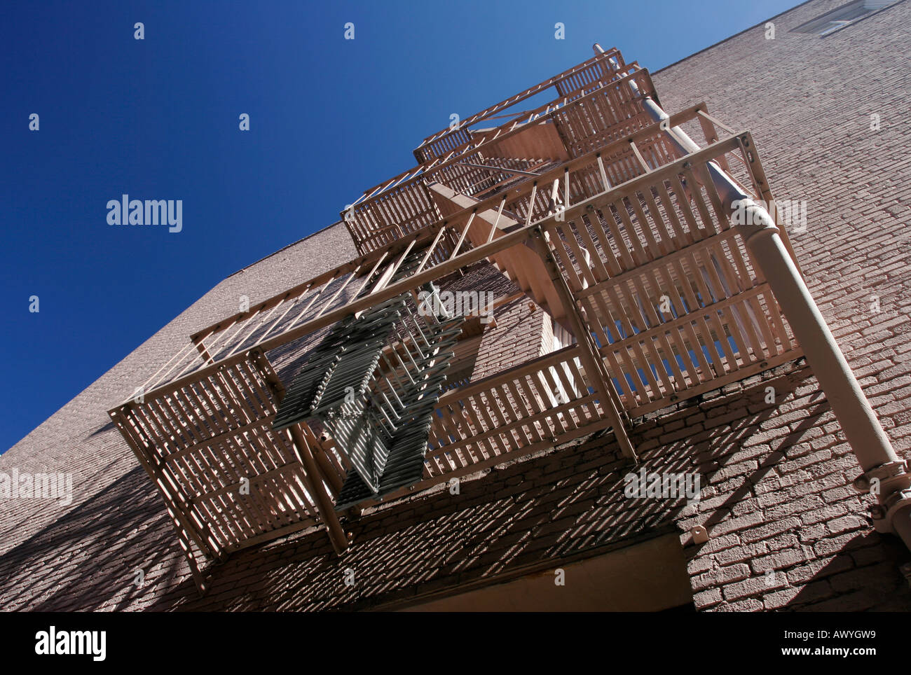Emergency exit staircase in an old brick building, Financial district ...
