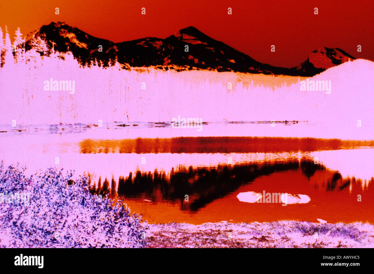 abstract black mountains reflected in lake negative false color Stock ...