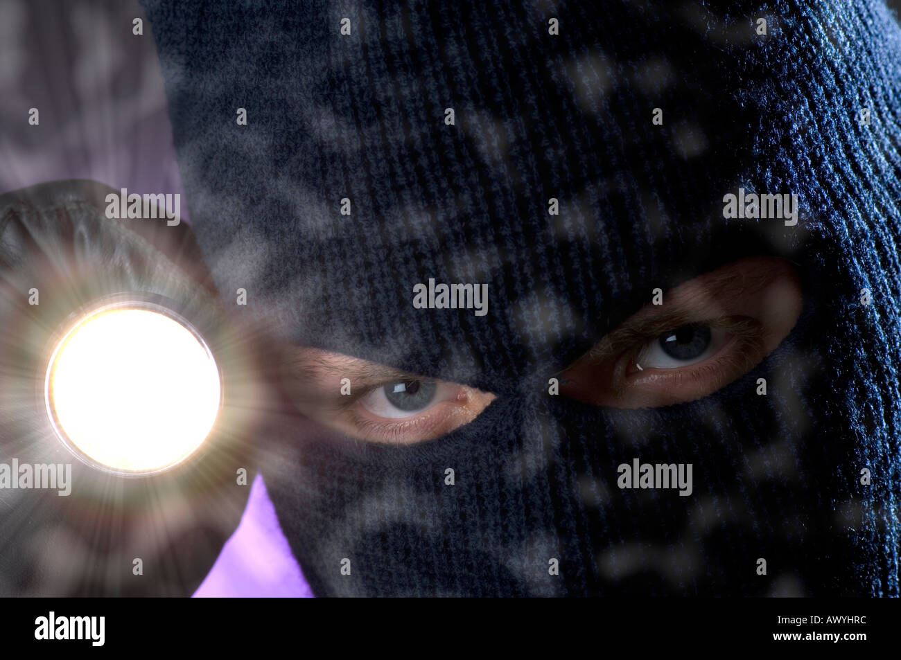 man with flashlight wearing ski mask breaking into bank vault Stock ...