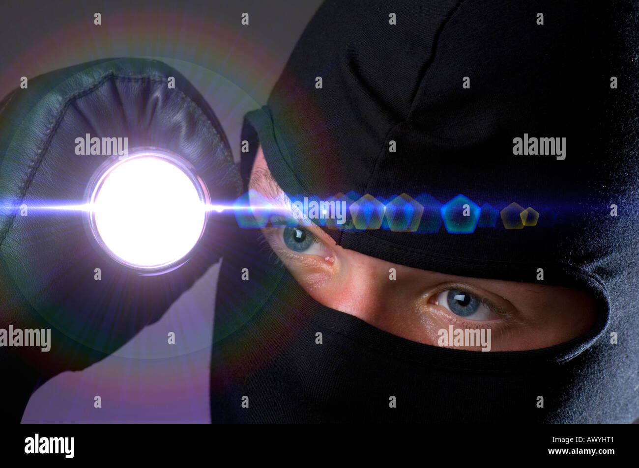 man with flashlight wearing ski mask breaking into bank vault Stock ...