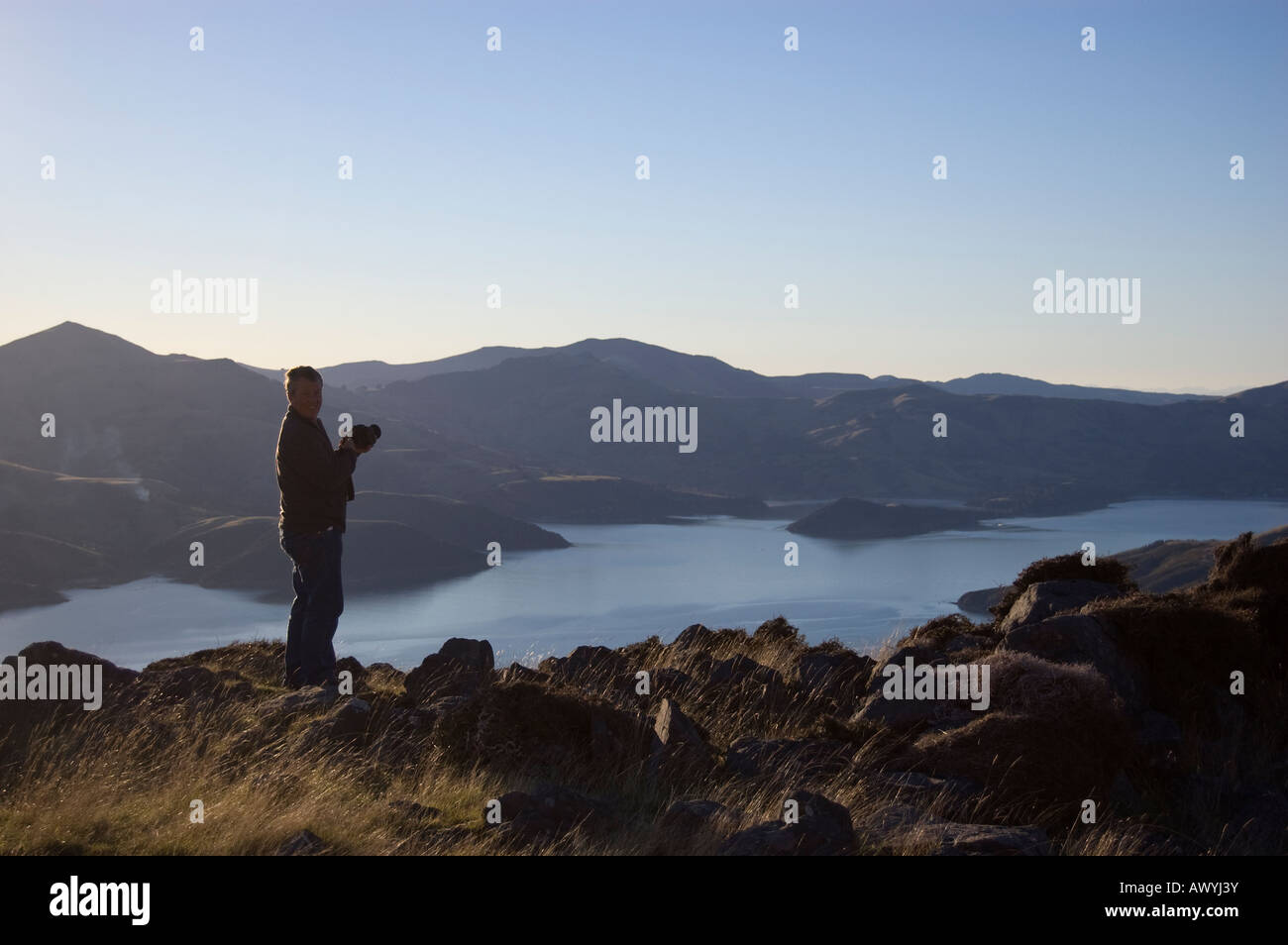 Terry Whittaker photographing Akaroa's landscape, New Zealand Stock ...