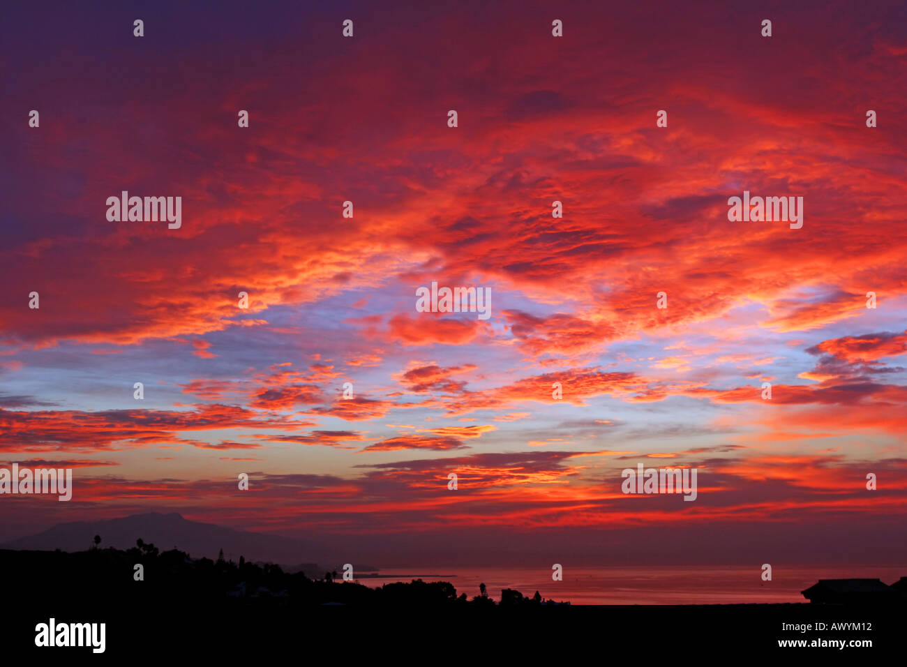 Amazing deep red sky of sunrise in Spain Stock Photo - Alamy