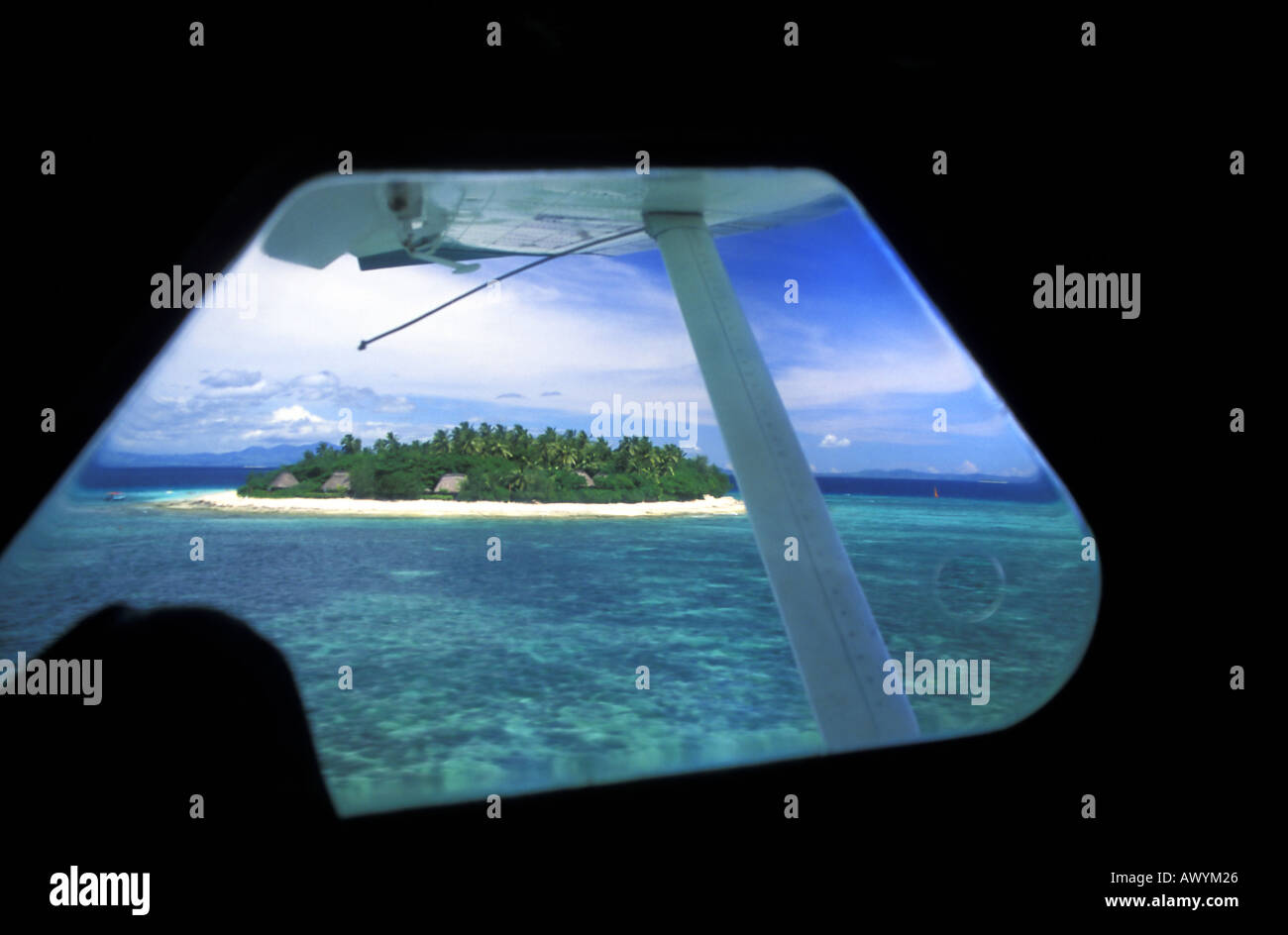 Perfect tropical island viewed through the window of a seaplane Stock ...