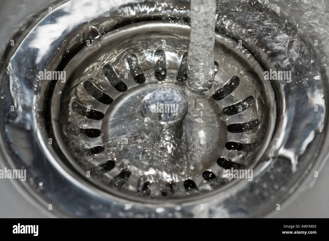 Water running down kitchen sink drain hi-res stock photography and ...