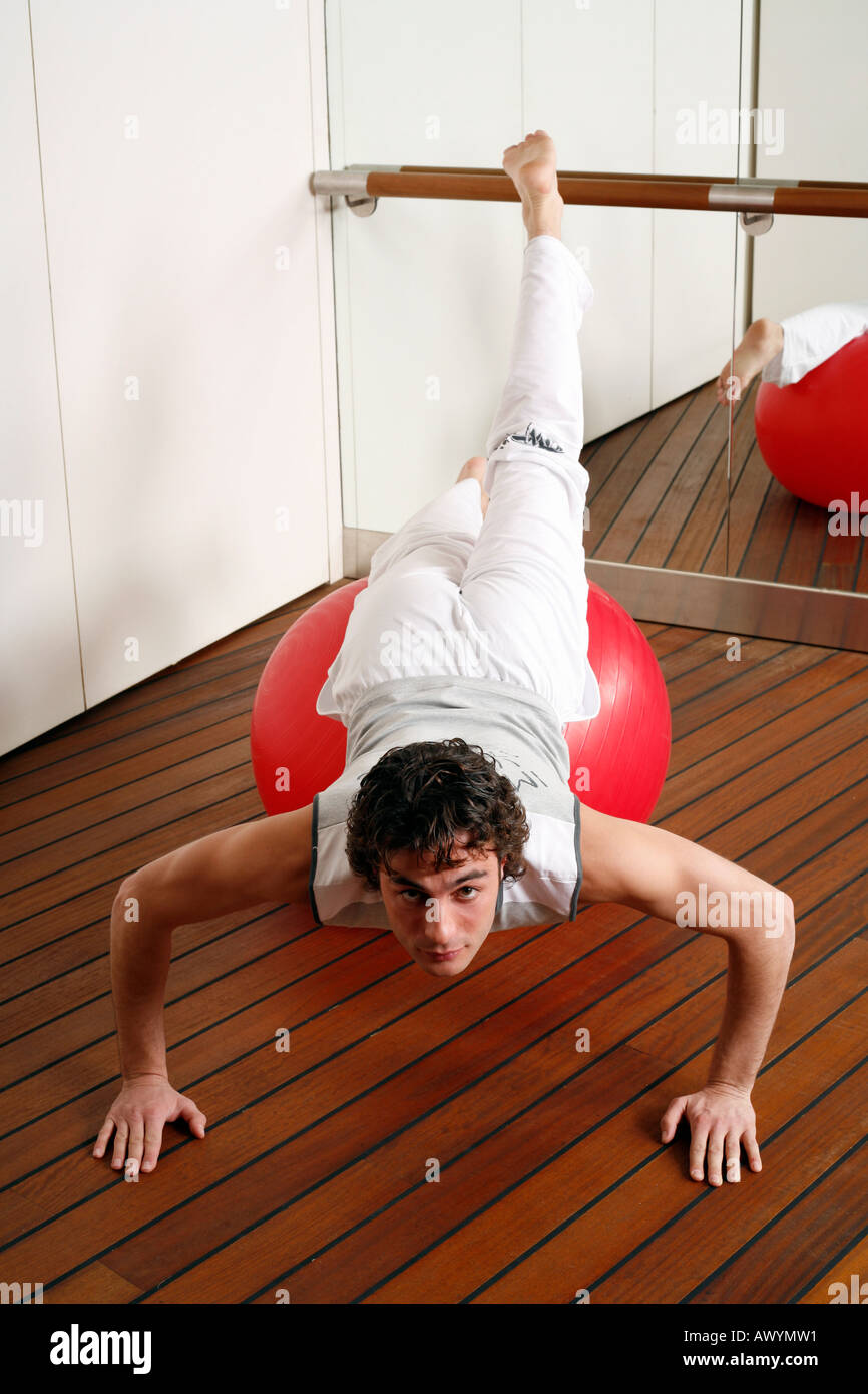 Man performing pilates exercises hi-res stock photography and images ...