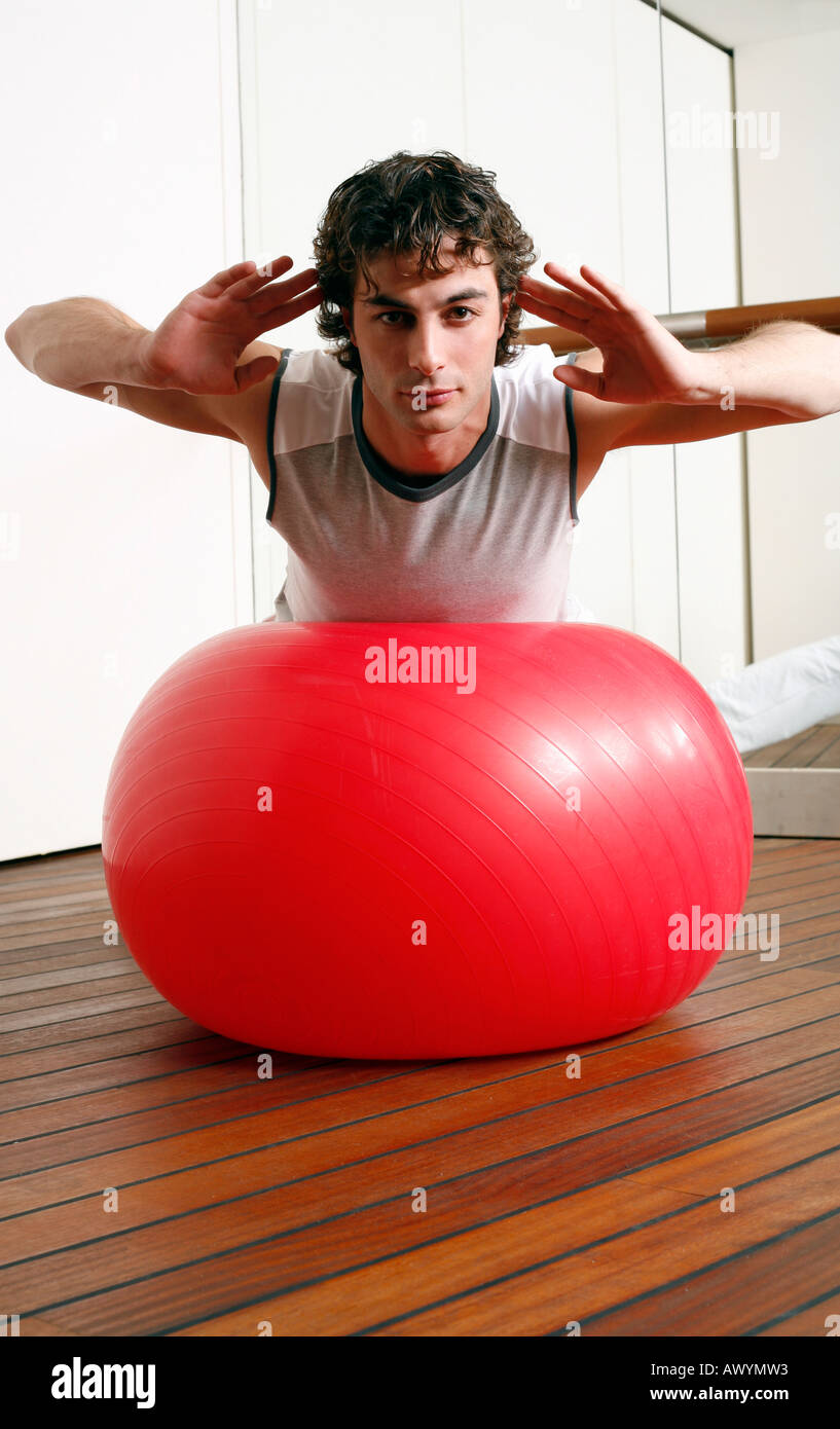 Man performing pilates exercises hi-res stock photography and images ...