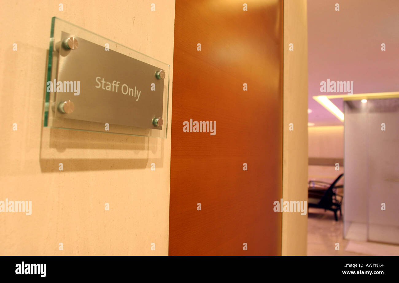 Staff only sign in hallway Stock Photo - Alamy
