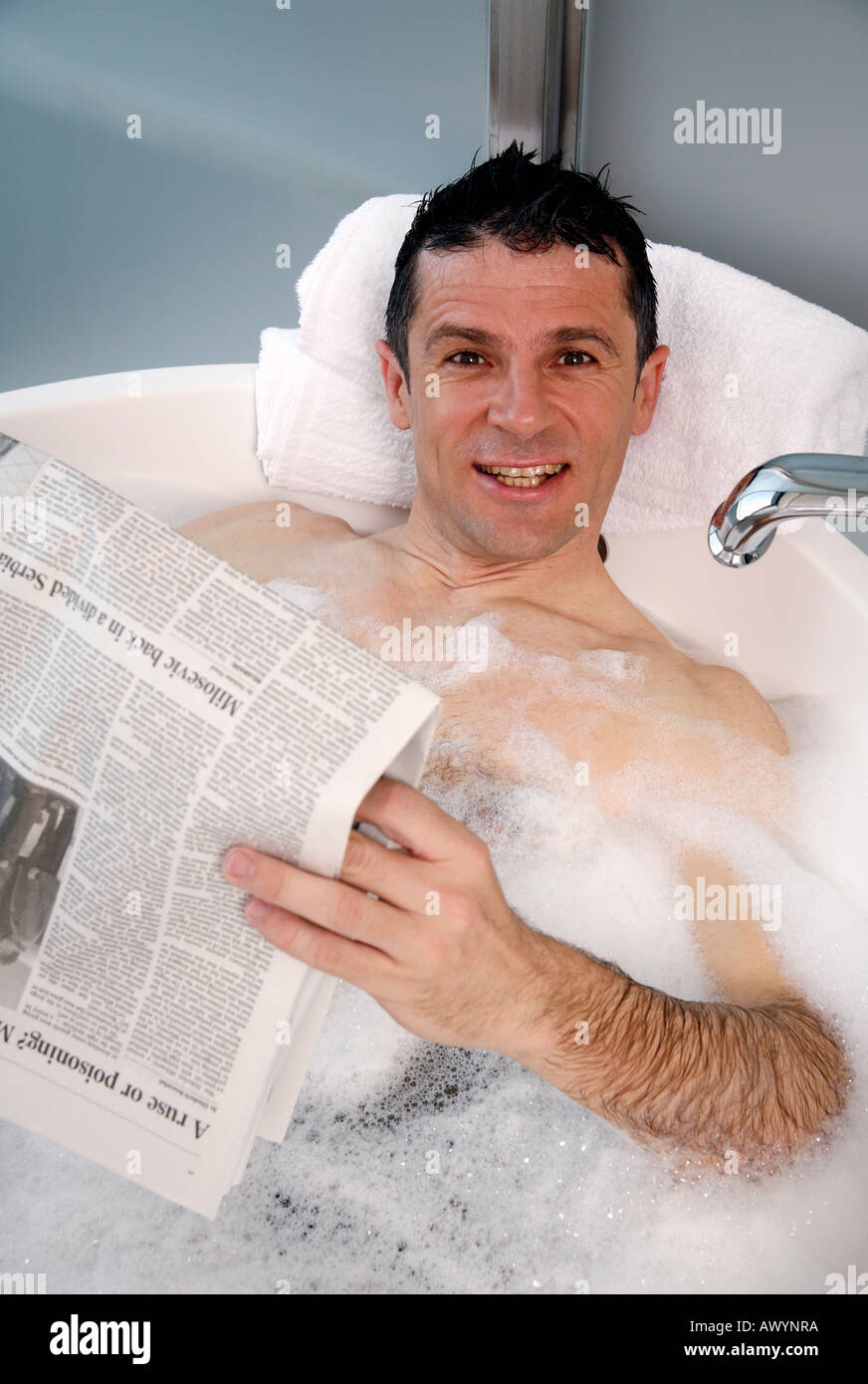 Man relaxing in bathtub with bubbles Stock Photo - Alamy