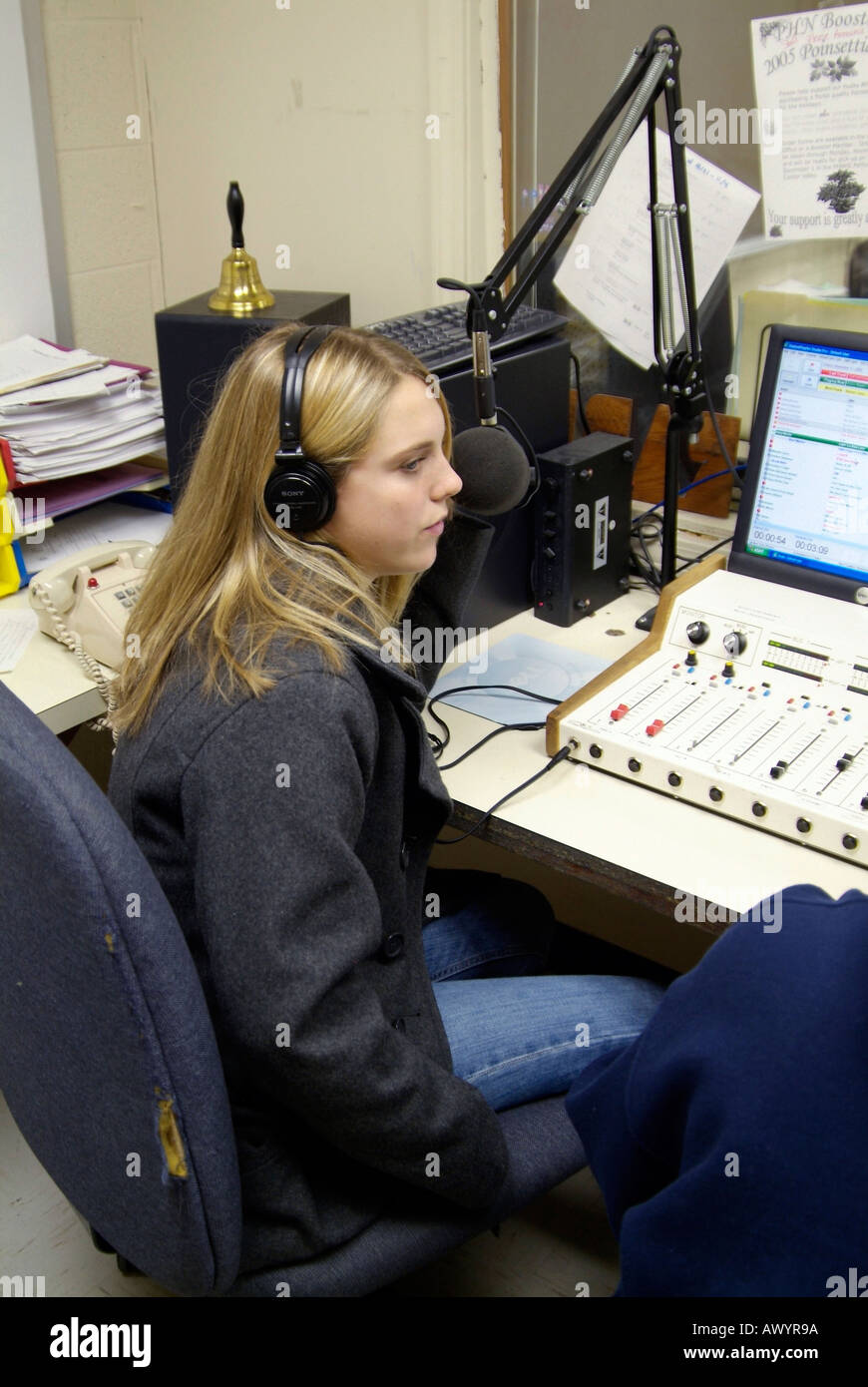 Ethnic male and female high school students learn about radio ...