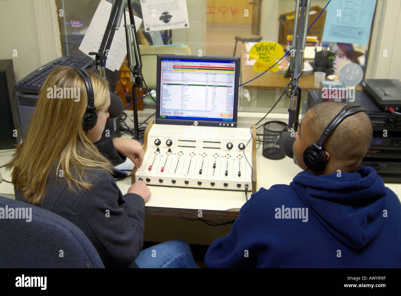 Ethnic male and female high school students learn about radio ...