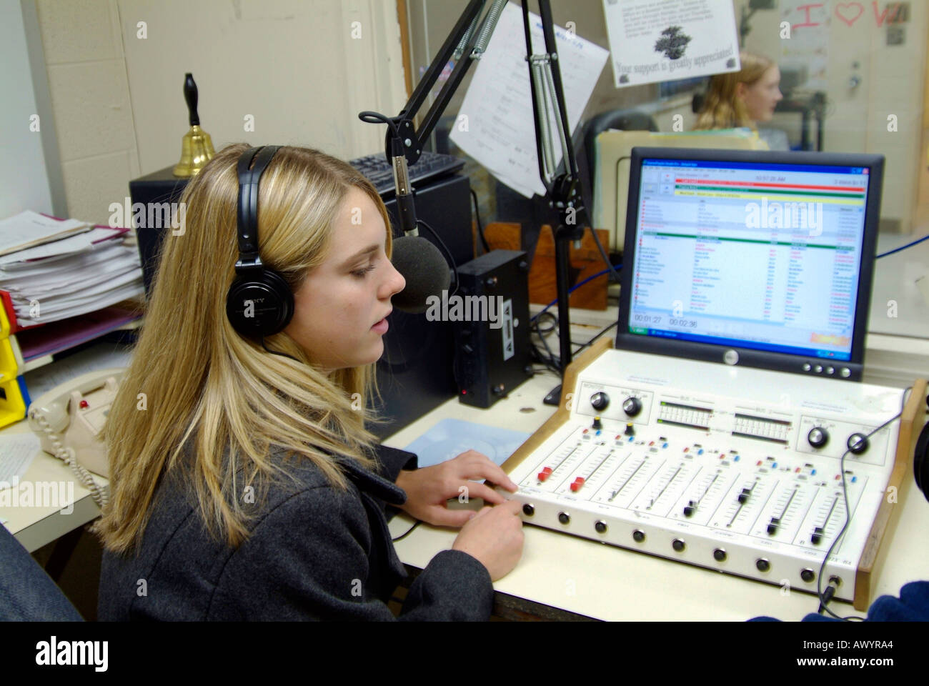 Ethnic male and female high school students learn about radio ...