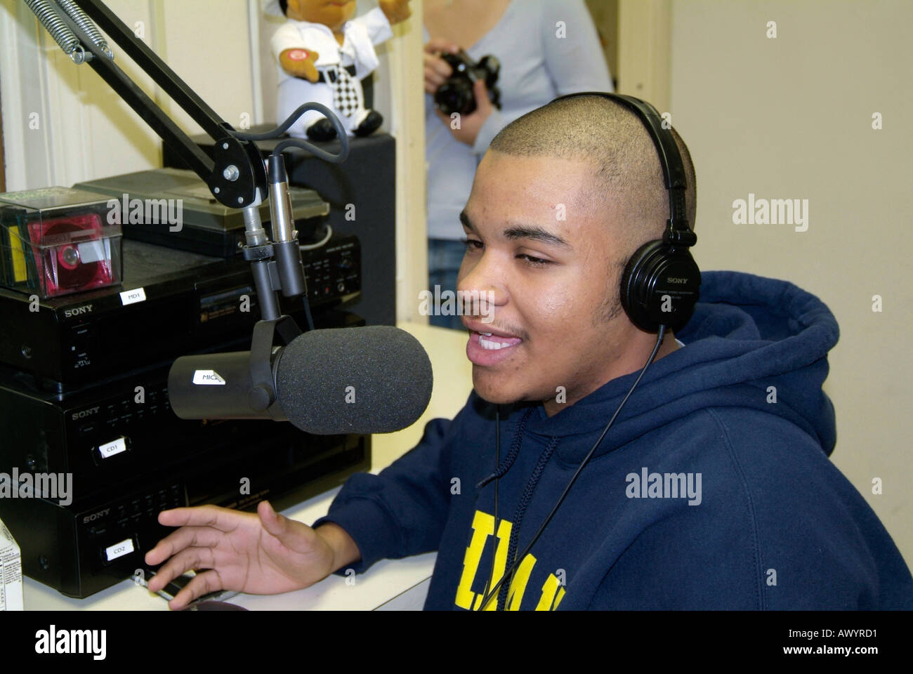 Ethnic male and female high school students learn about radio ...