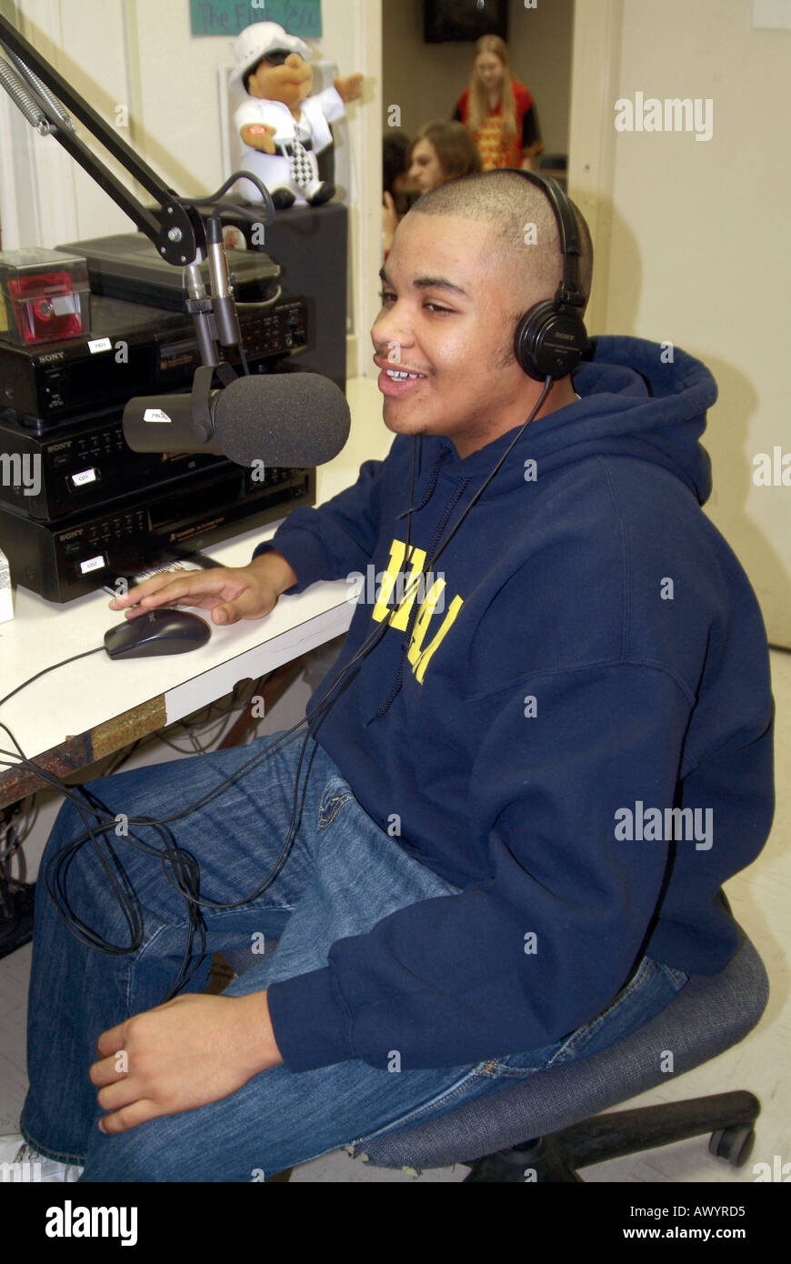 Ethnic male and female high school students learn about radio ...