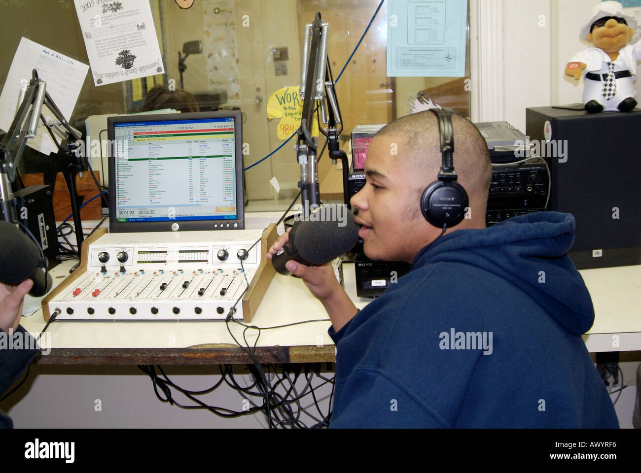 Ethnic male and female high school students learn about radio ...