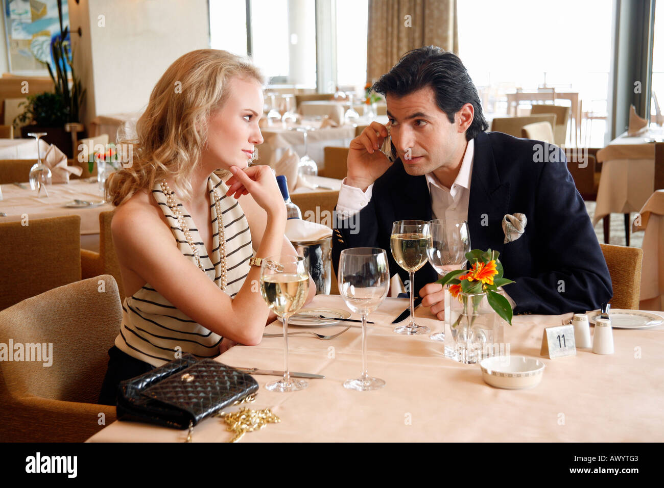Couple having a romantic moment in a restaurant Stock Photo - Alamy