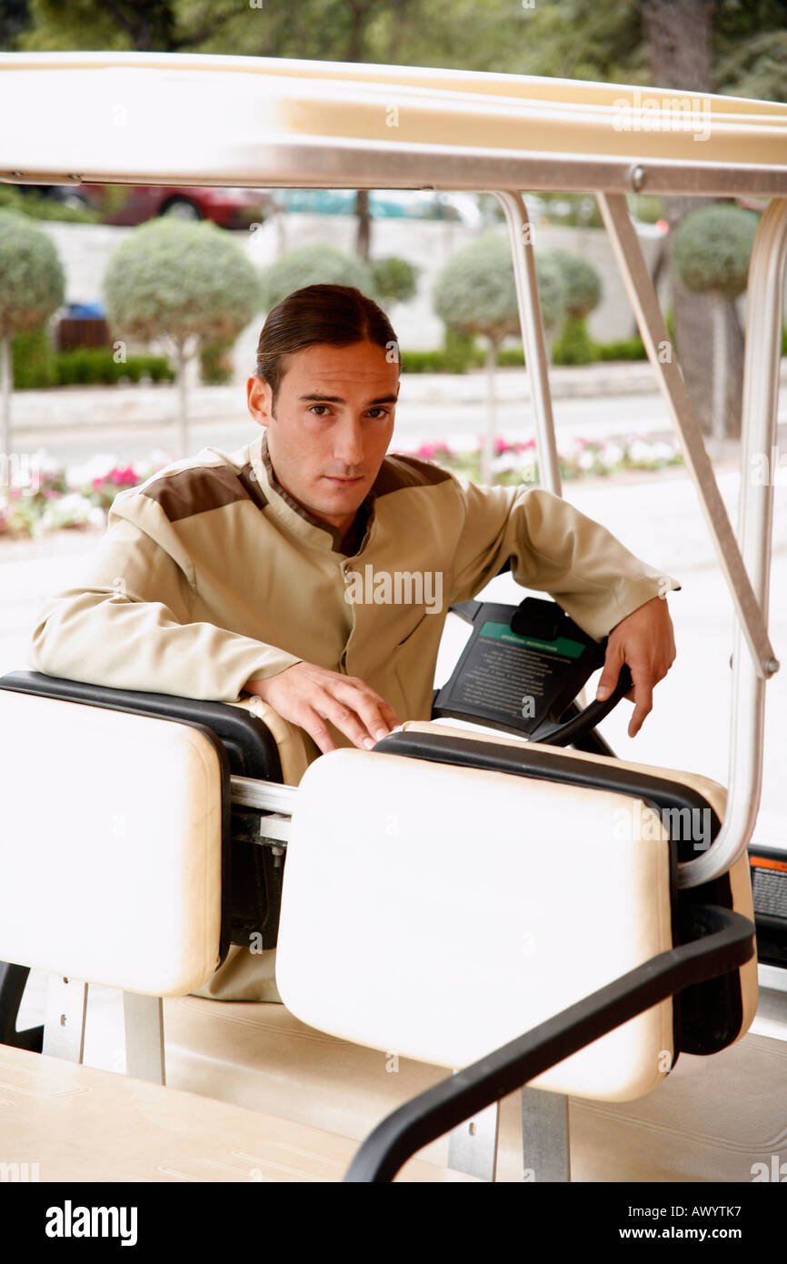 Bellboy driving hotel cart Stock Photo - Alamy