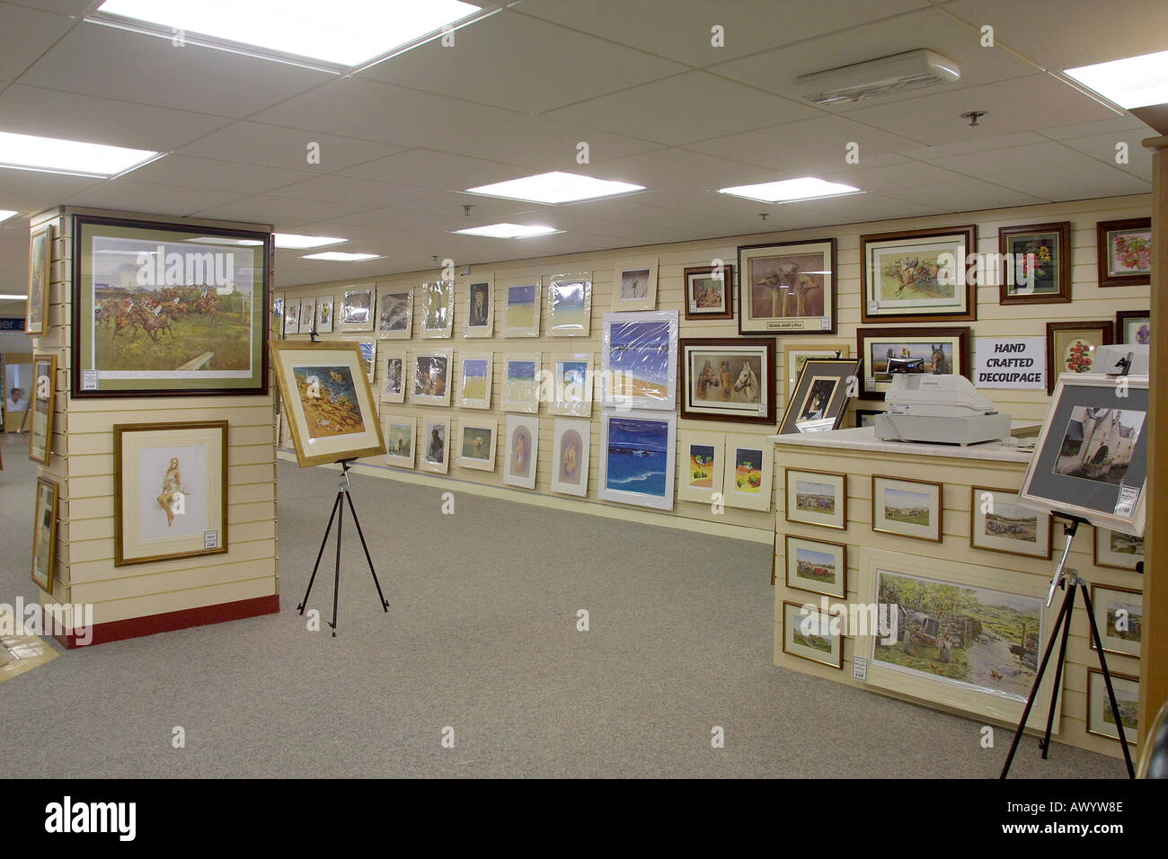 Pictures on display in art shop department store Stock Photo - Alamy