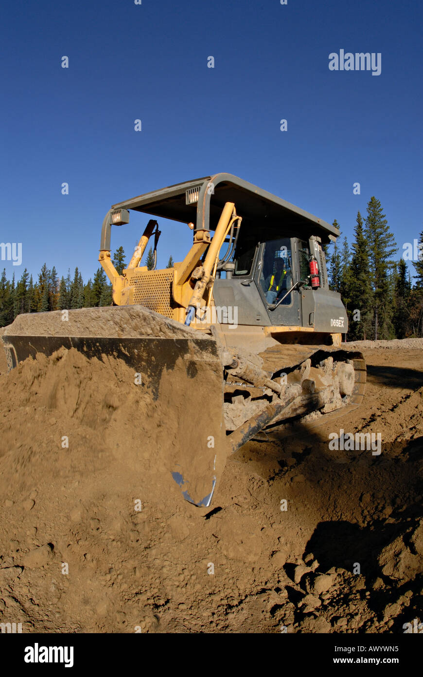 Buldozer pushing soil Stock Photo - Alamy