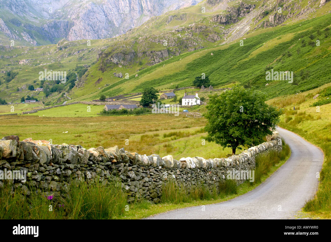 Road winding through the Nnant Ffrancon Valley Snowdonia Wales with a ...