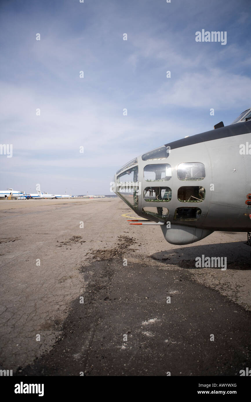 the front part of a military airplane landed on a runway Stock Photo ...