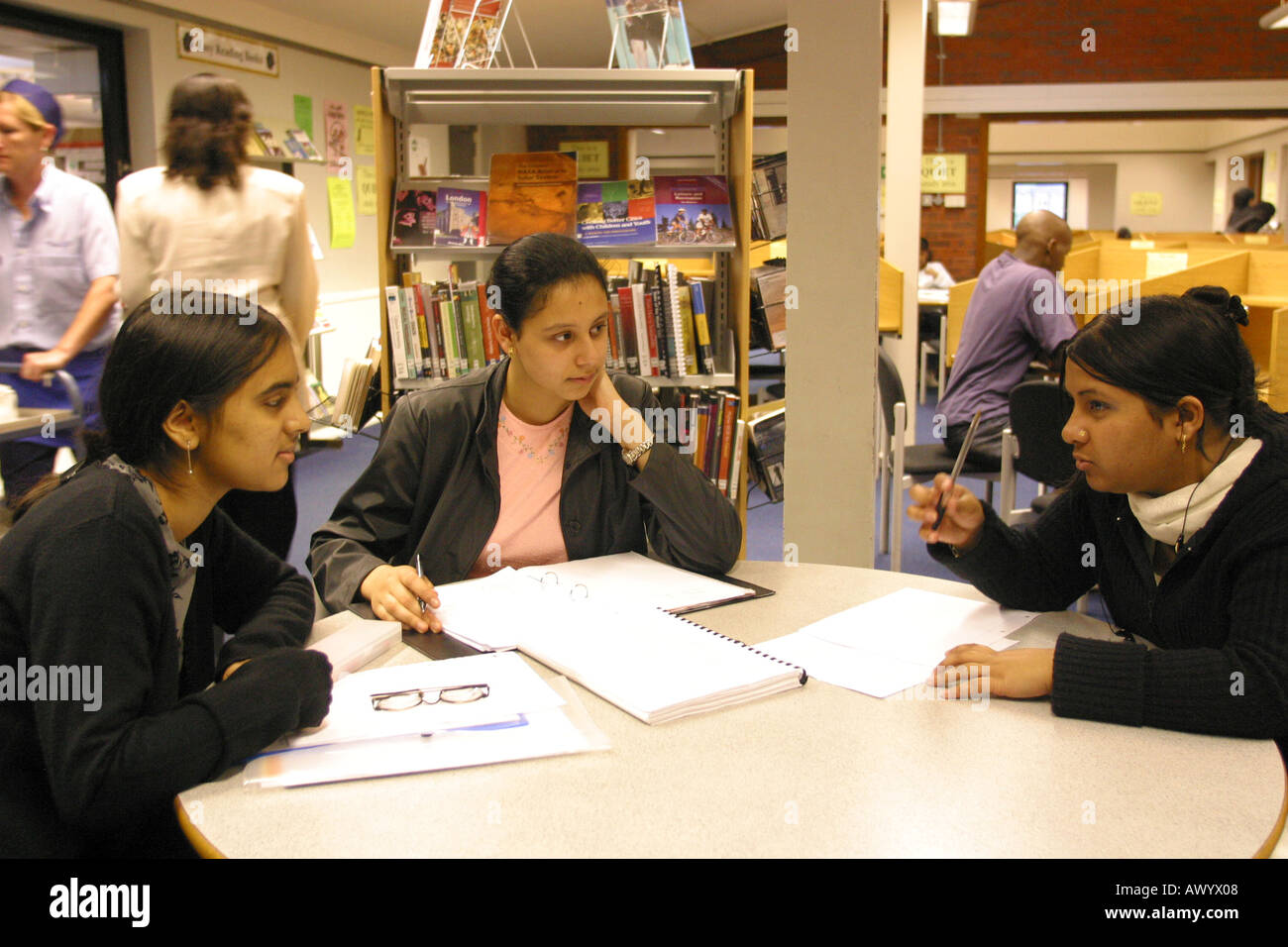 Female students studying at 6th form college library Stock Photo - Alamy