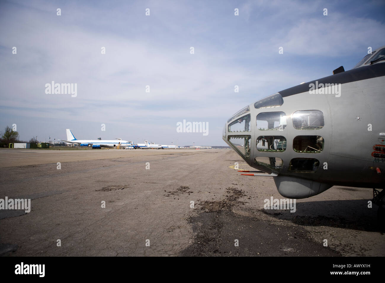 the front part of a military airplane landed on a runway Stock Photo ...
