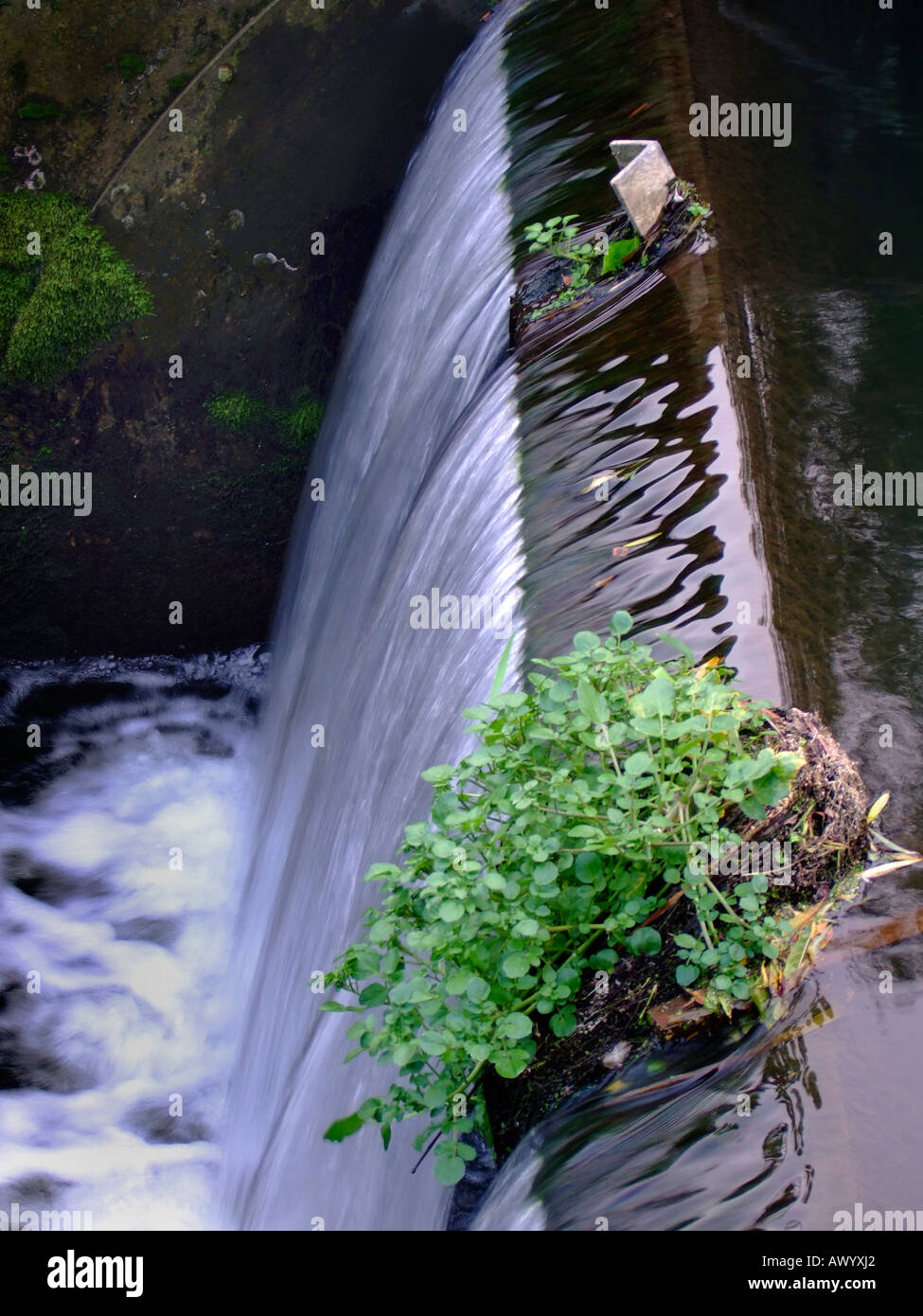 water flowing over weir Stock Photo - Alamy