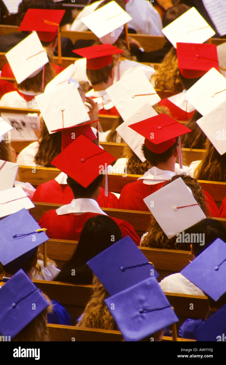 Red Graduation Caps In The Air