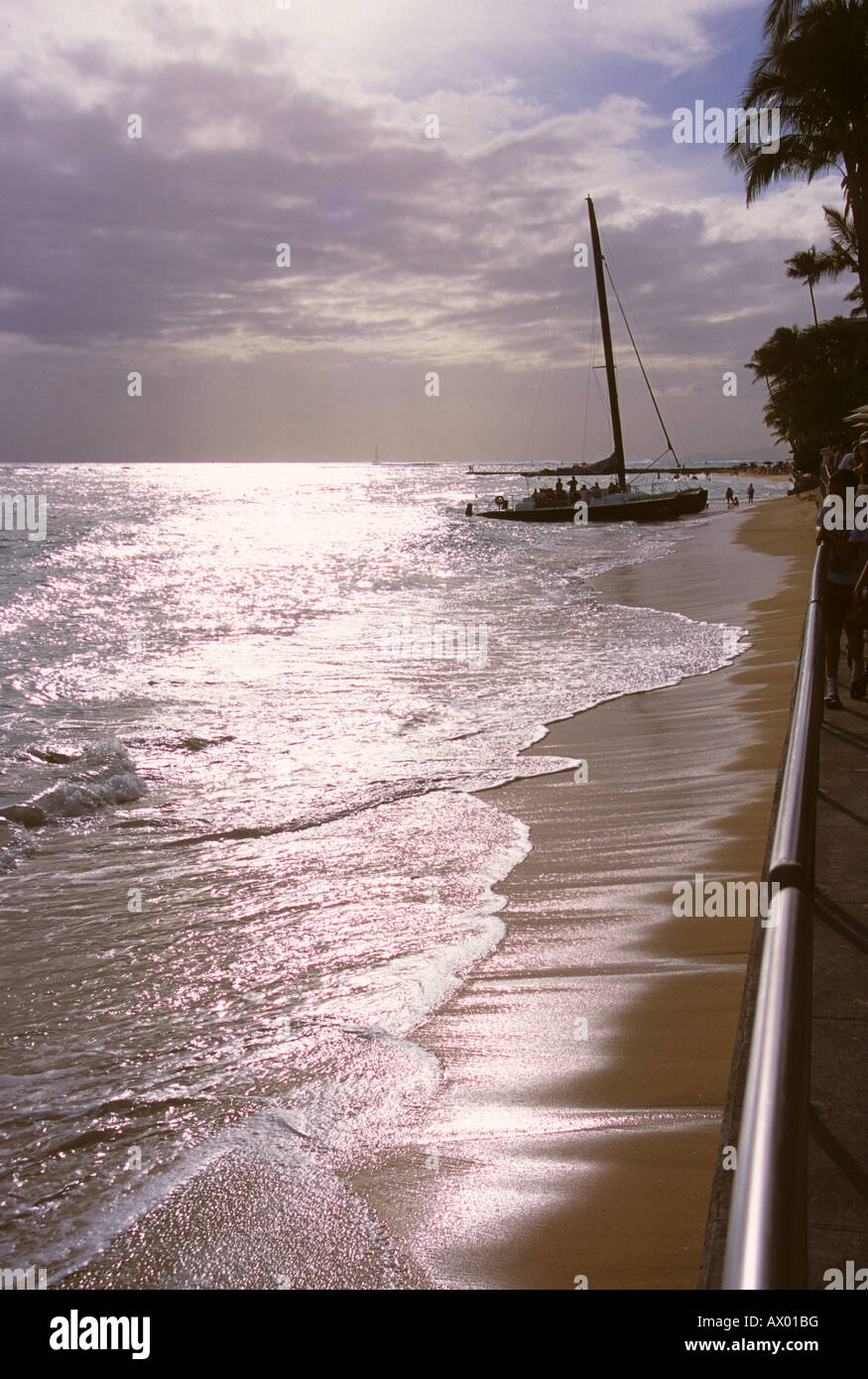 Catamaran sailboat lands on beach in Hawaii Stock Photo - Alamy