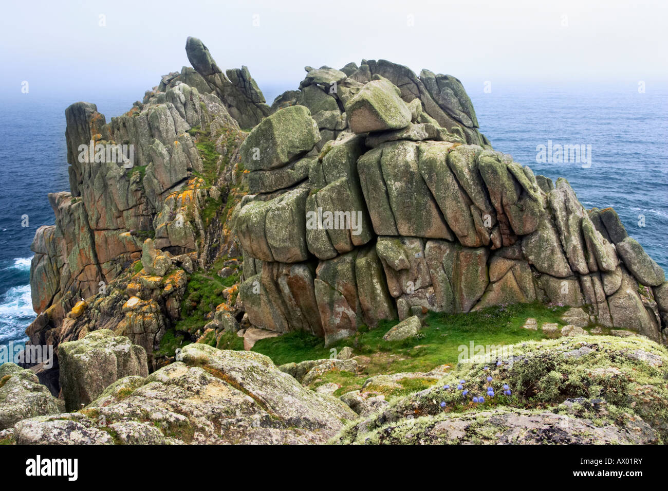 The rocking Logan Rock at Porthcurno Bay near Treen in Cornwall ...