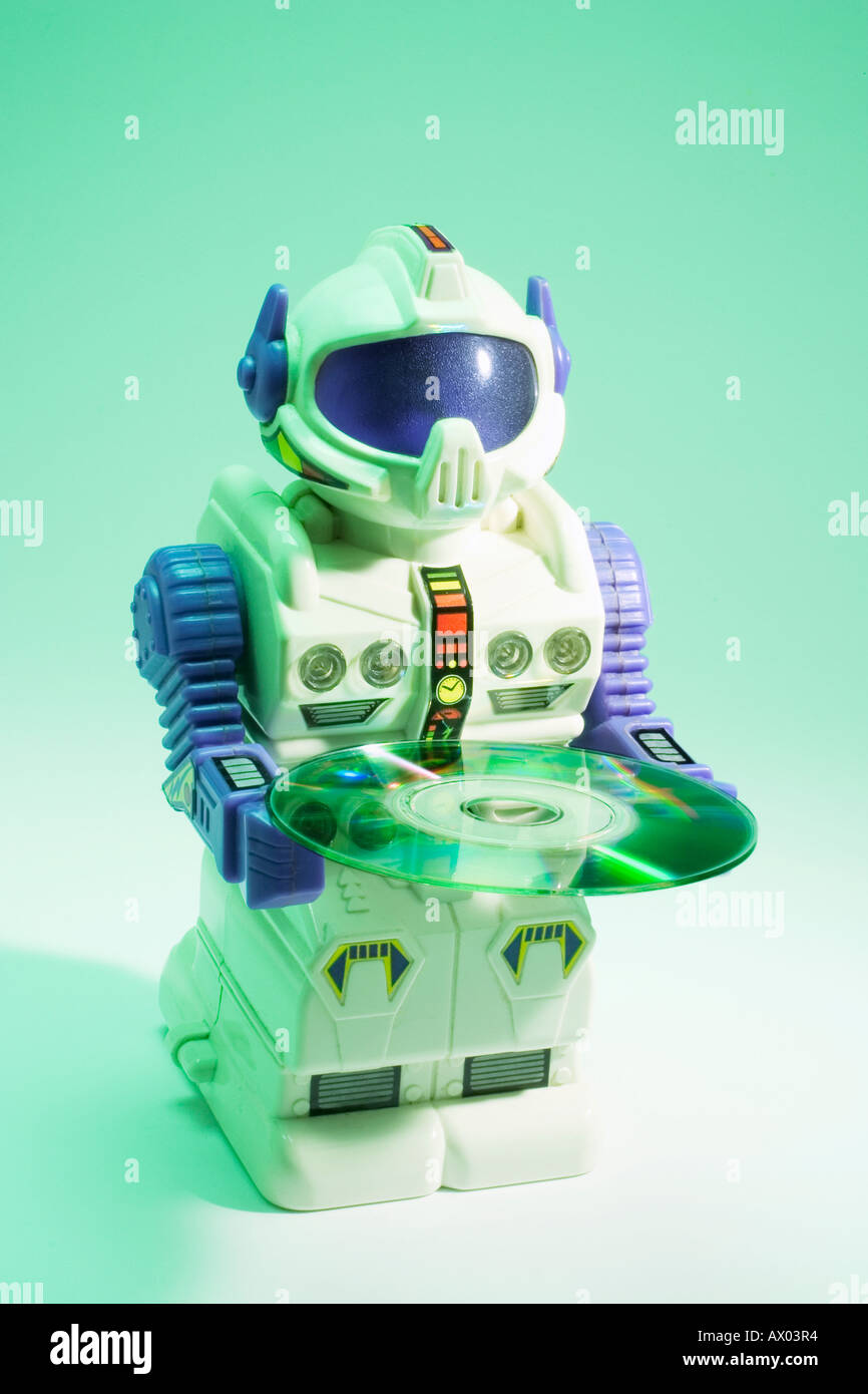 Toy Robot Holding CD Stock Photo - Alamy