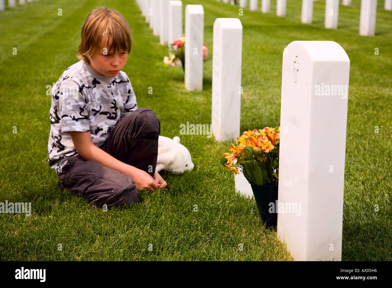 Boy in cemetary Stock Photo - Alamy