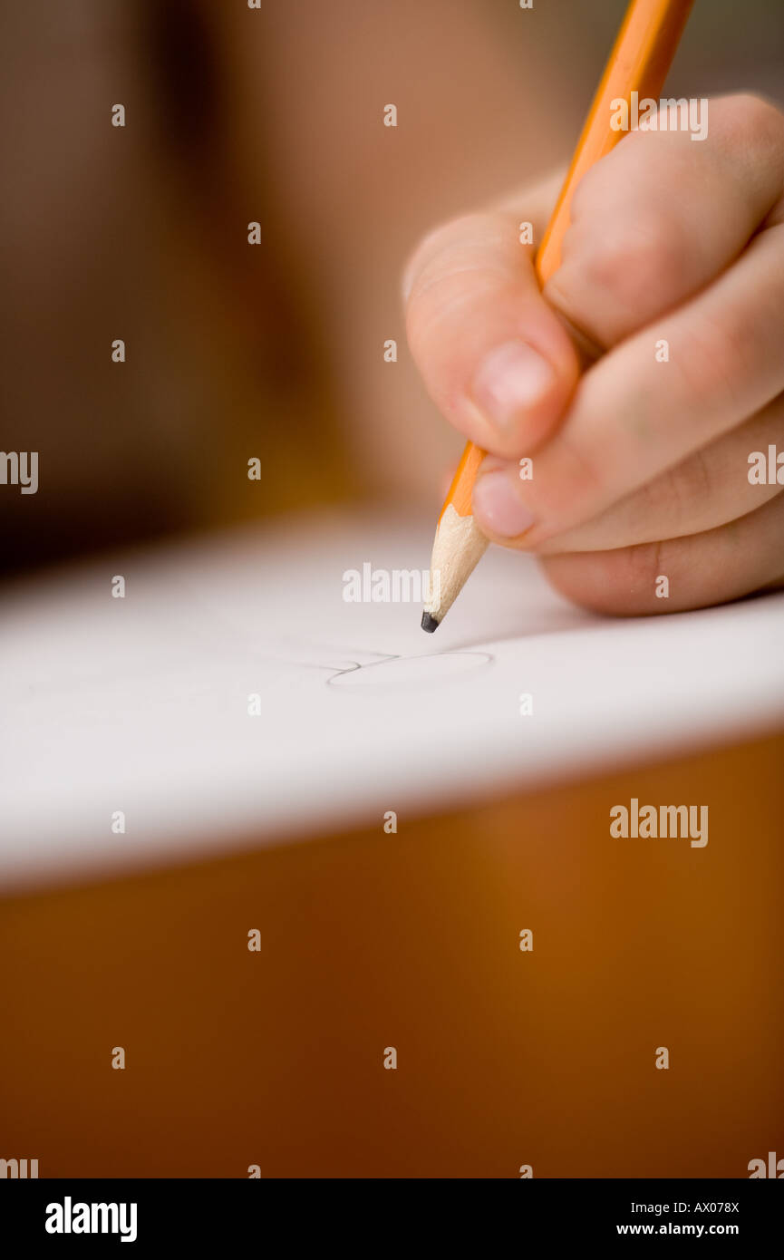 A child hand holding a pencil Stock Photo - Alamy