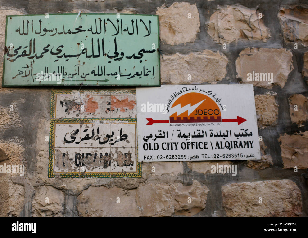 Arabic signs hang in a market in the old city section of Jerusalem ...