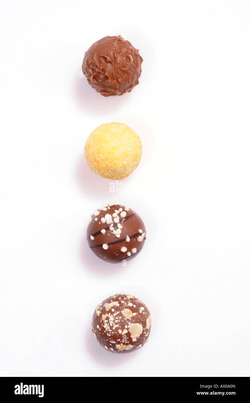 Row of chocolate pralines hi-res stock photography and images - Alamy