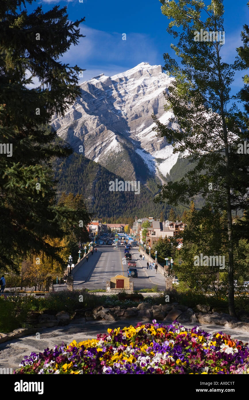 Banff Avenue, Cascade Mountain looms above the town of Banf, Banff National Park, Alberta ...