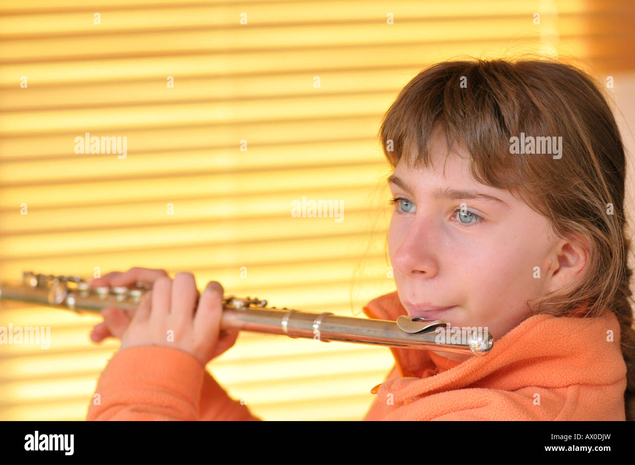 Girl playing the flute Stock Photo - Alamy